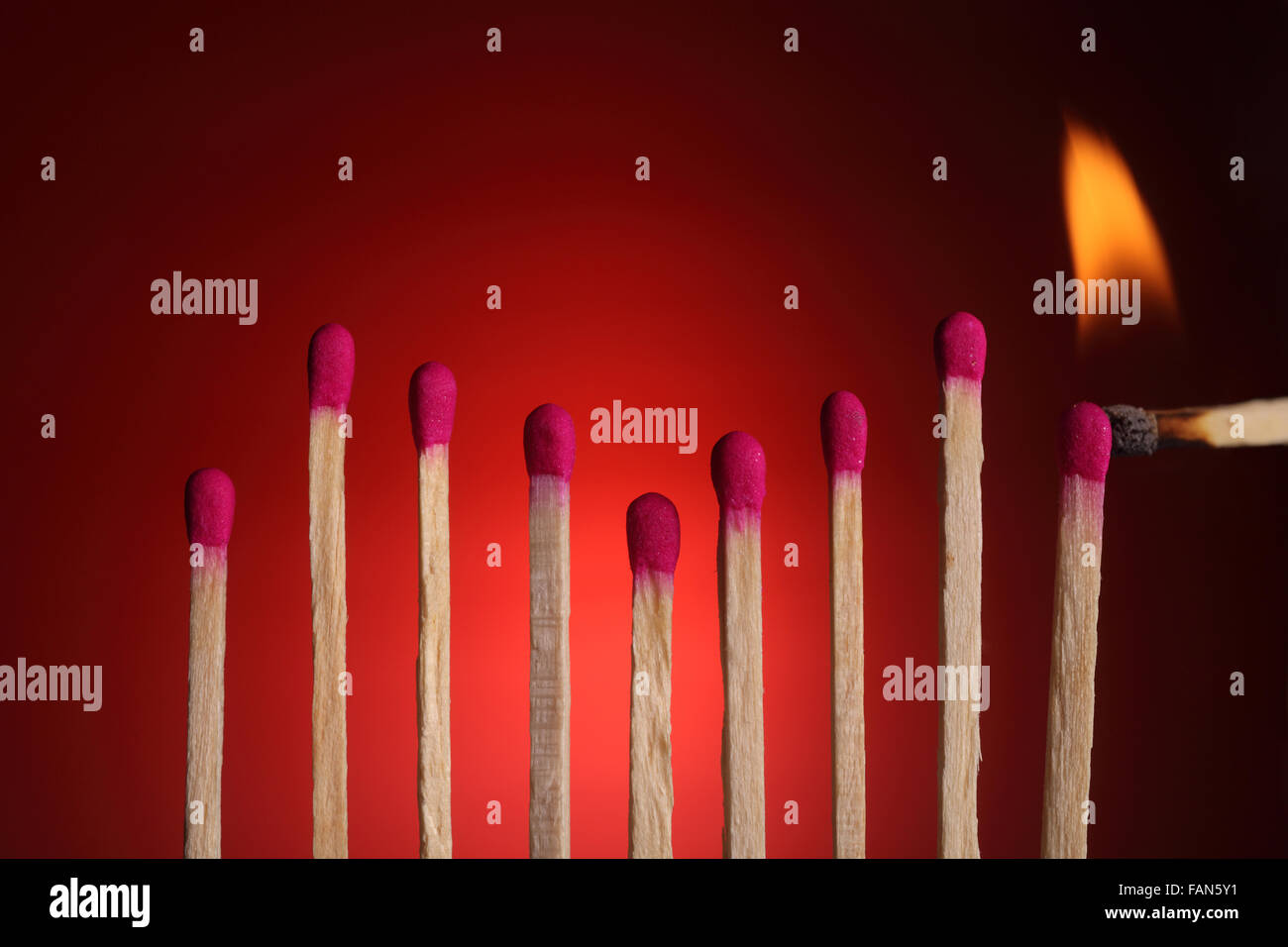 Graph made of red matches, last one burning Stock Photo - Alamy