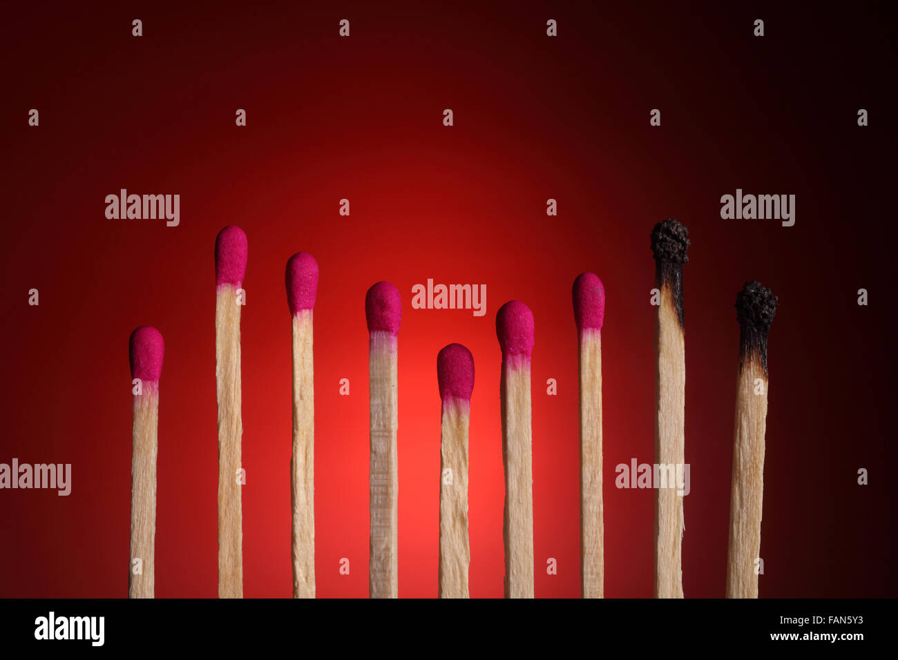 Graph made of red matches, last one burning Stock Photo - Alamy