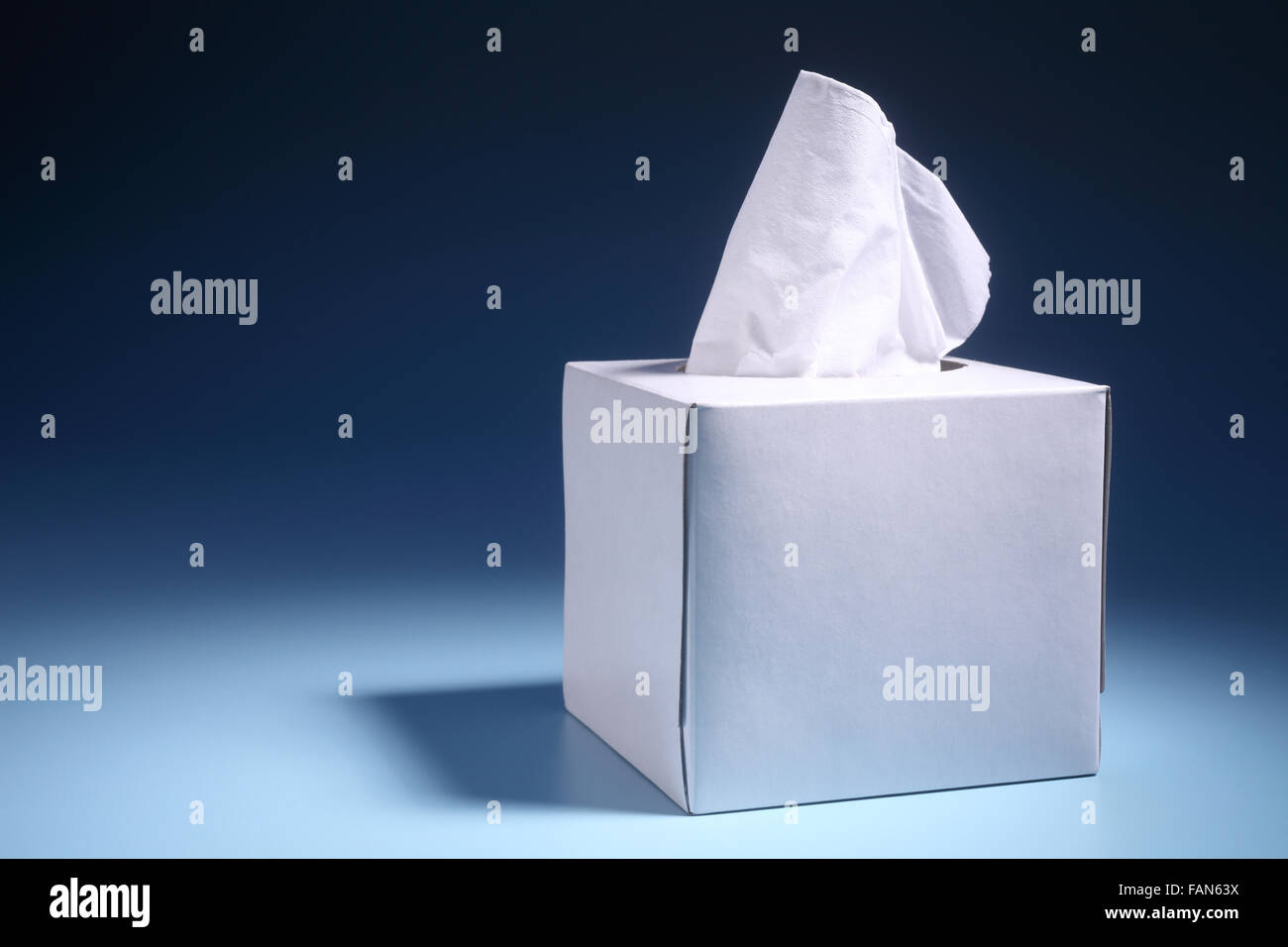 tissue paper box on the blue background Stock Photo - Alamy