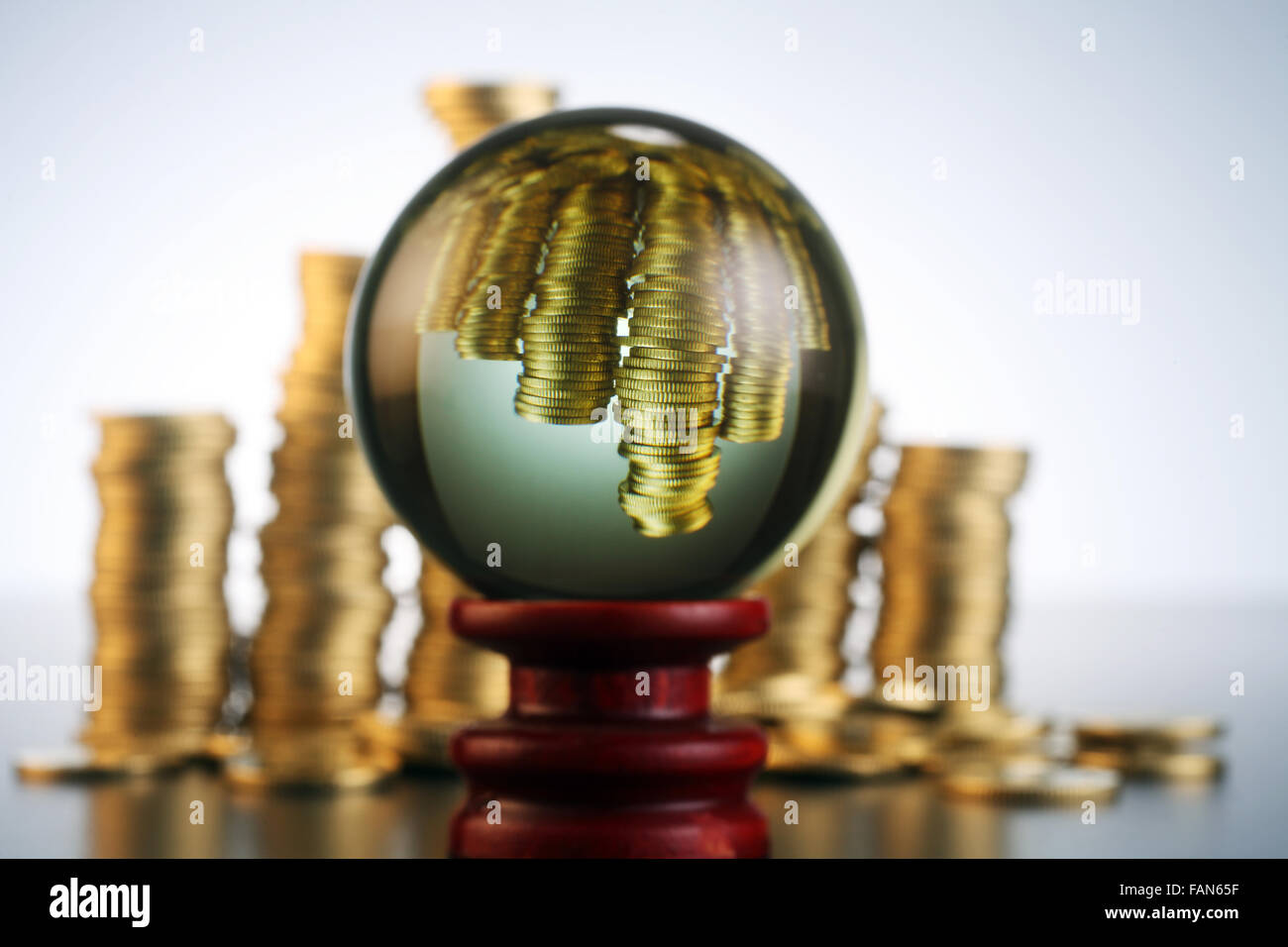 conceptual image coin in the crystal ball Stock Photo - Alamy