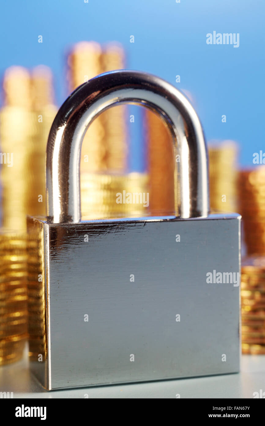close up money secured with lock Stock Photo - Alamy