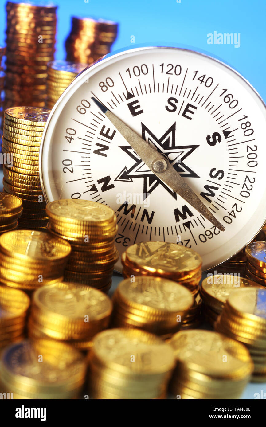 stacks of the coin and the compass Stock Photo - Alamy