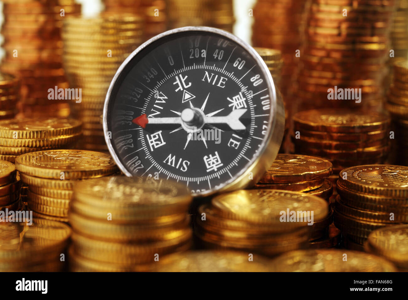 stacks of the coin and the compass Stock Photo - Alamy