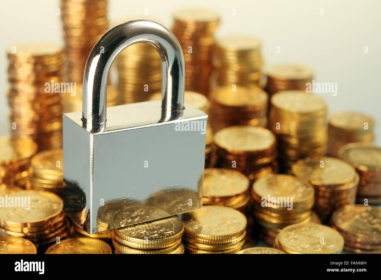 close up money secured with lock Stock Photo - Alamy