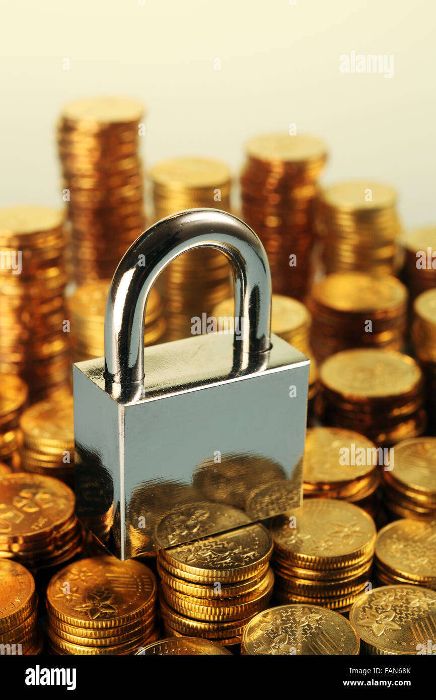 close up money secured with lock Stock Photo - Alamy