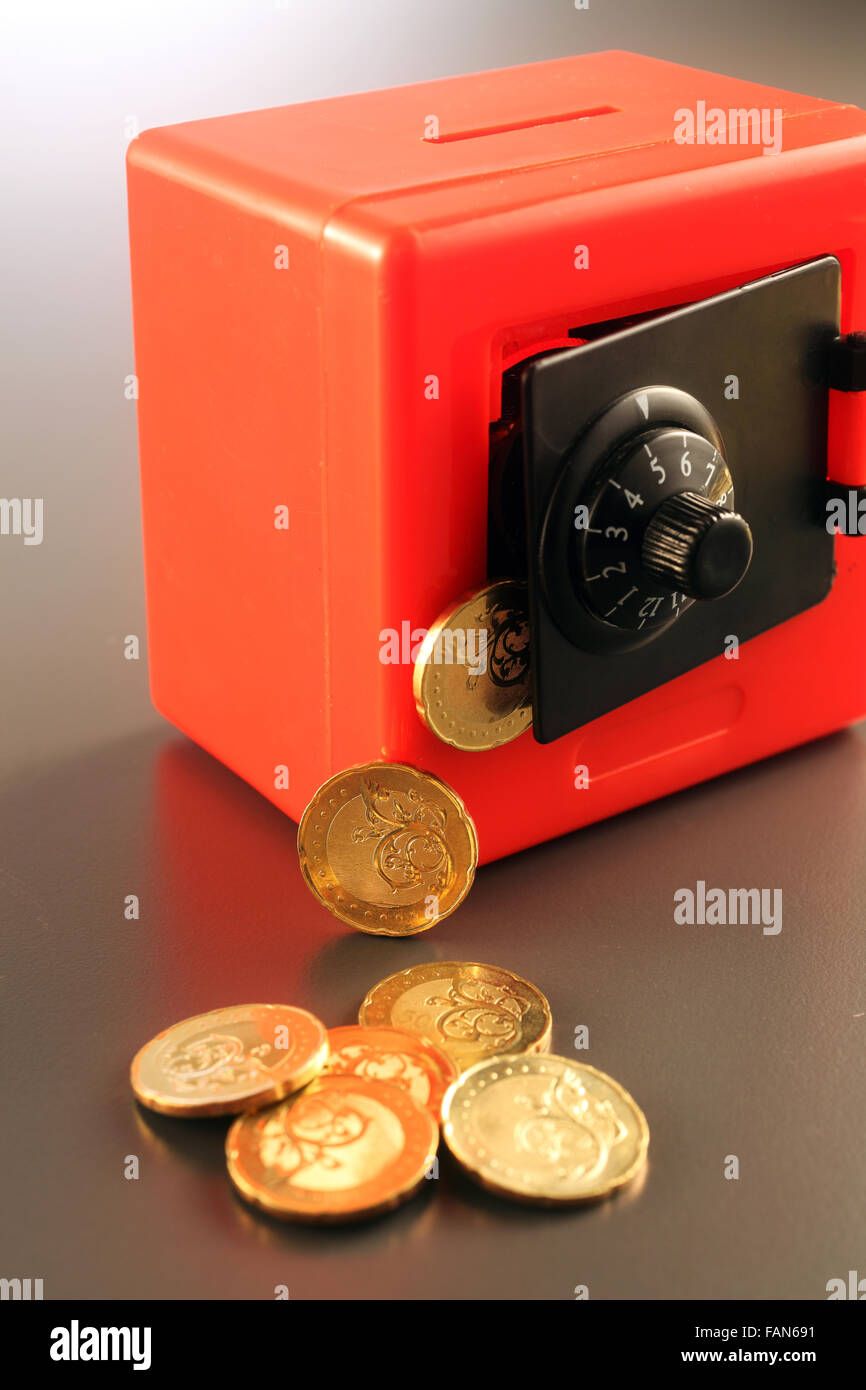 Toy Safe with Gold Coins Stock Photo - Alamy