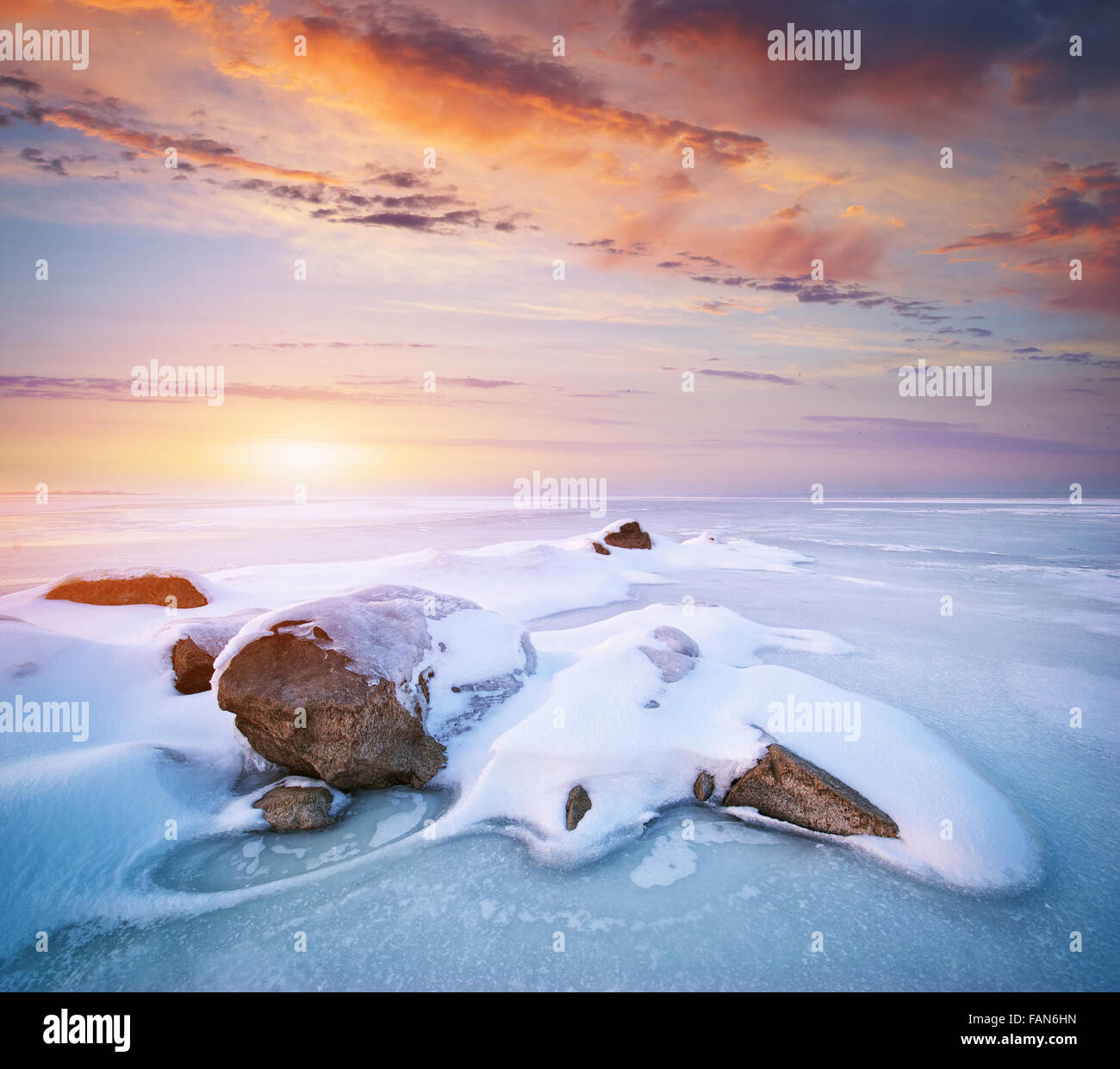 Stone on ice. Winter landscape Stock Photo - Alamy