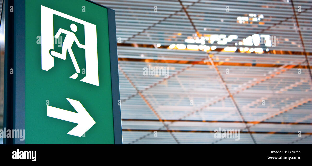 Sign of emergency exit in a Chinese airport, good for conceptual Stock ...