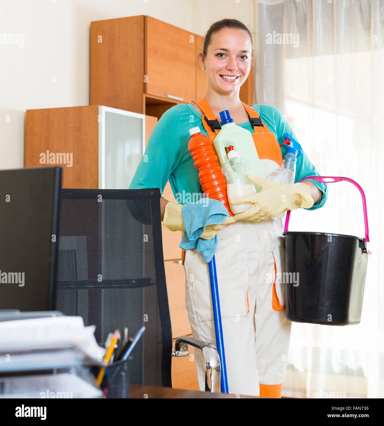 happy professional young american cleaner cleaning the office Stock ...