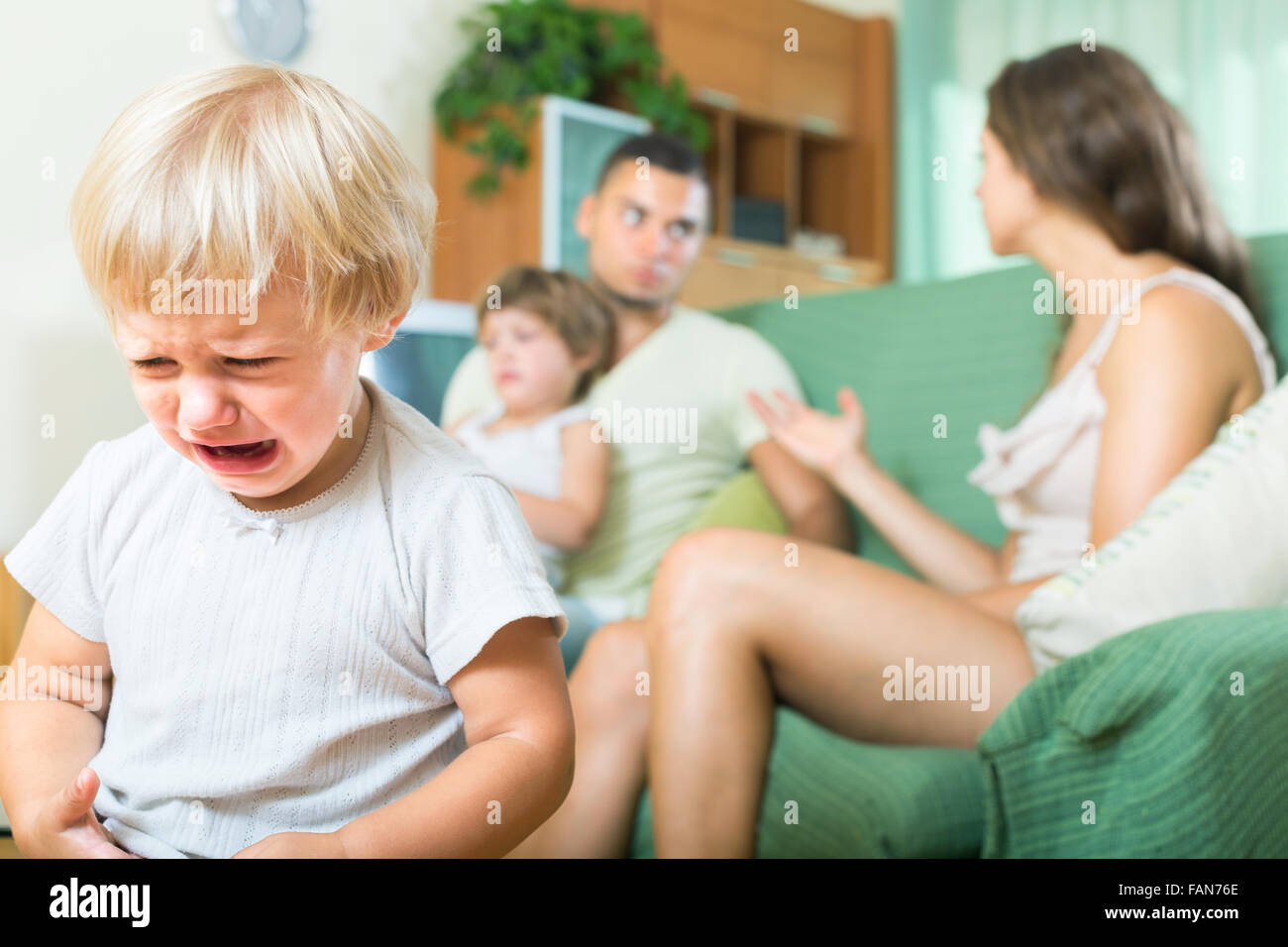Little child crying due to a quarrel of parents Stock Photo - Alamy