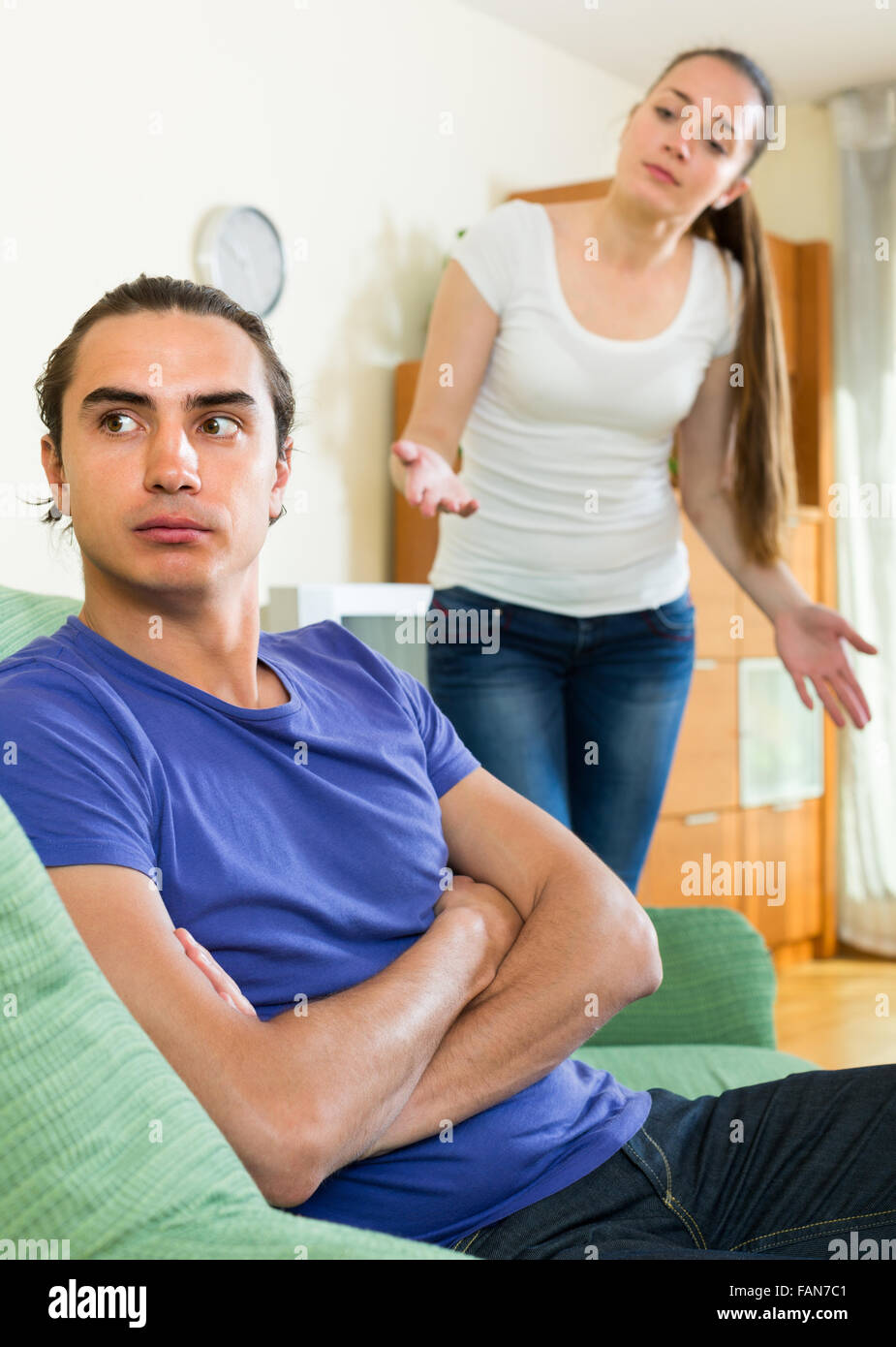 Ordinary young couple having conflict in the living room Stock Photo ...
