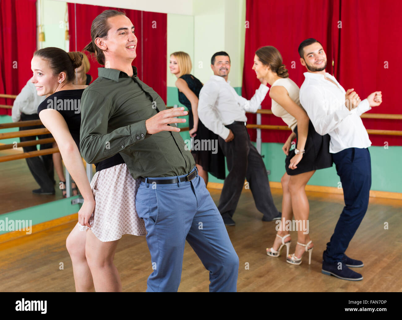 Smiling people dancing retro rock-and-roll in dancing class Stock Photo ...