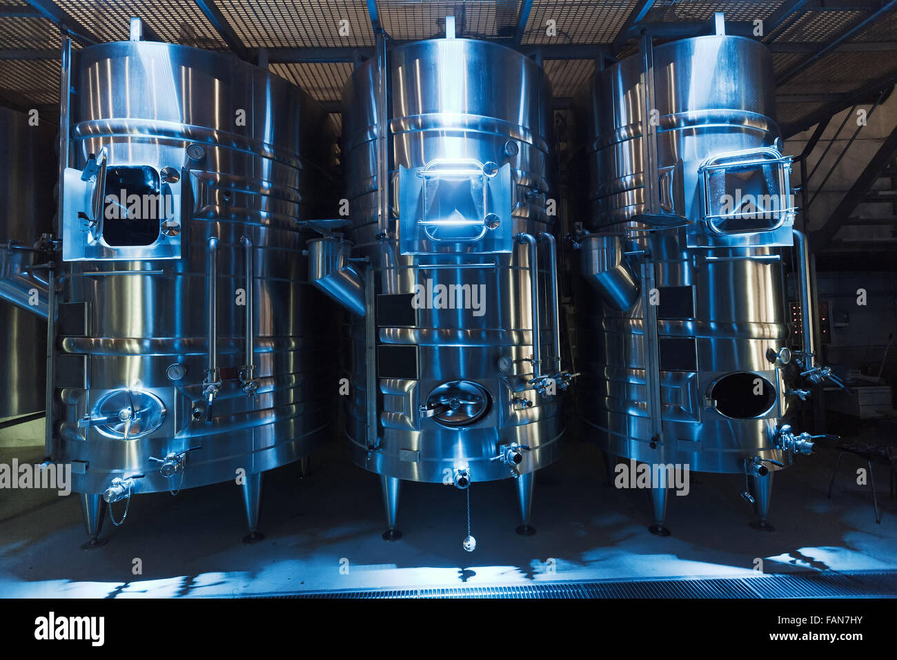 Modern stell barrels in interior of contemporary winemaker factory ...