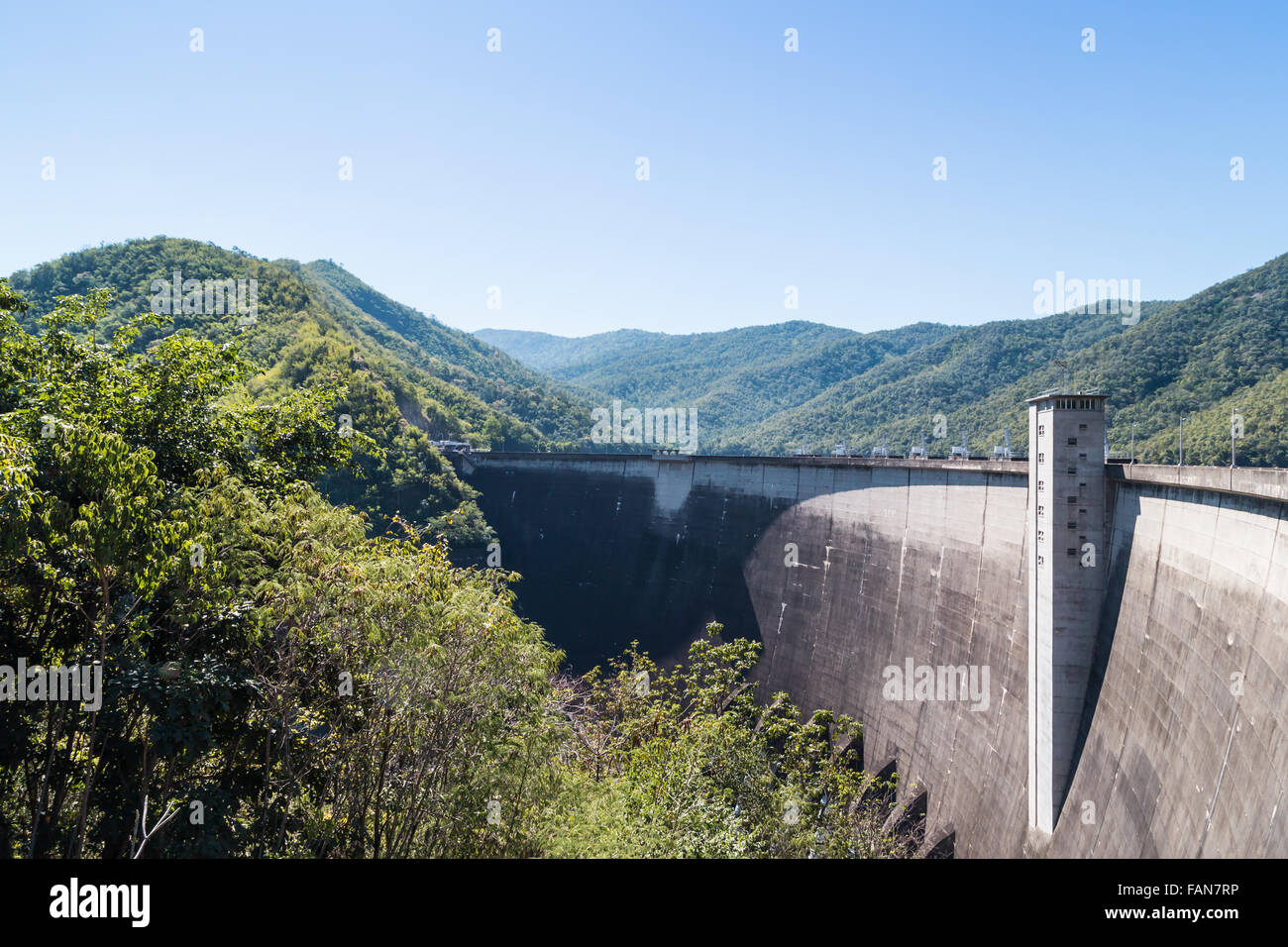 Concrete tall barrier of big dam in Thailand, surround by green ...