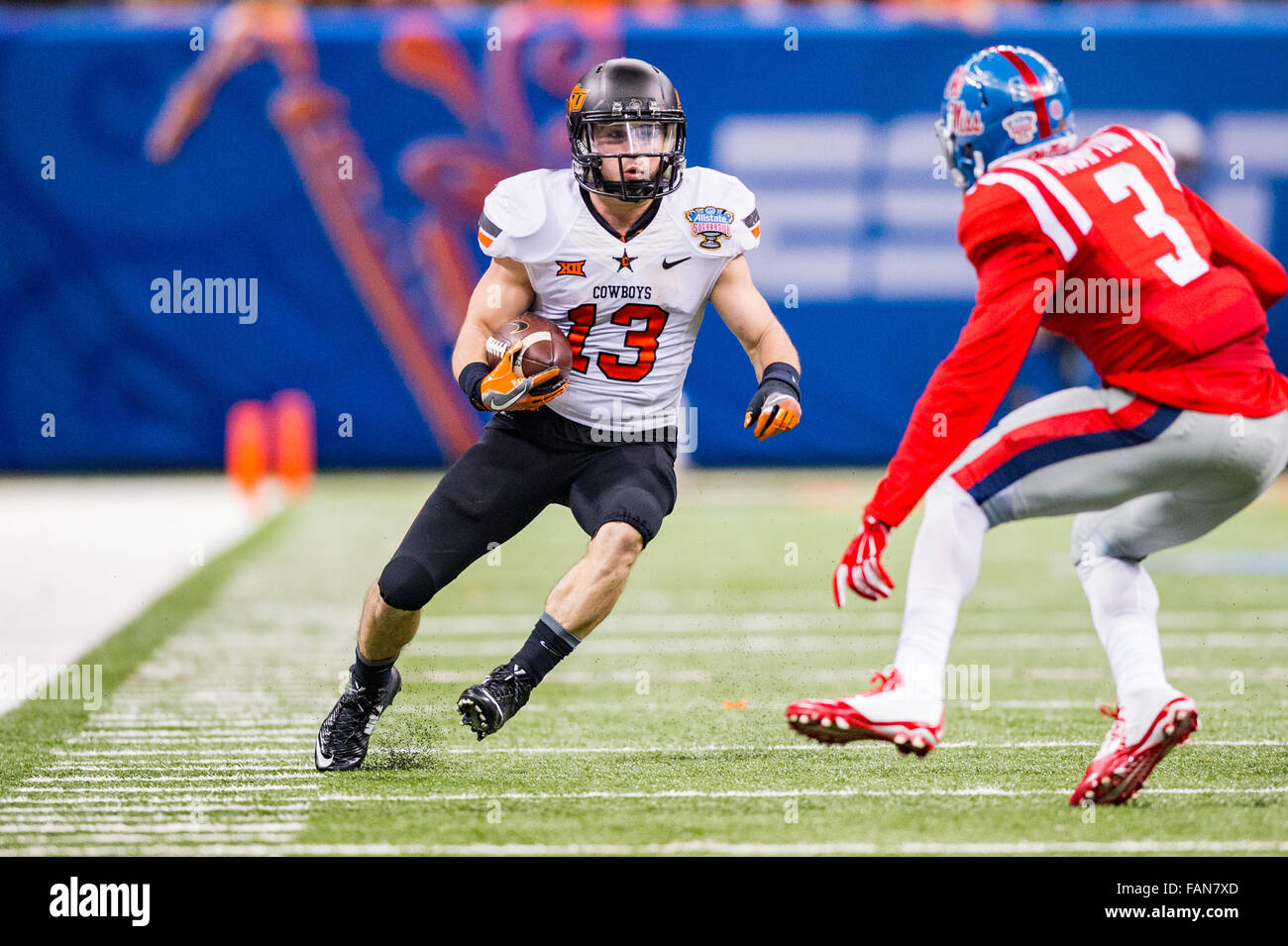 New Orleans, Los Angeles, USA. 1st January, 2016. Oklahoma State wide receiver David Glidden (13 ...