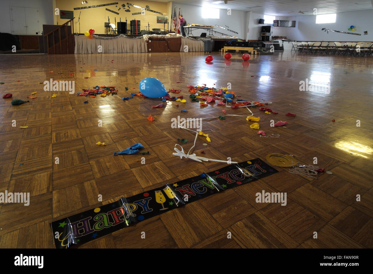 Auditorium floor littered with balloons and party favors left over from ...