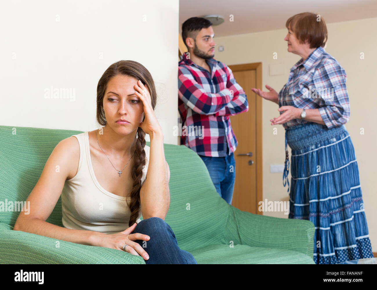 Home conflict between young married couple and elderly mother ...