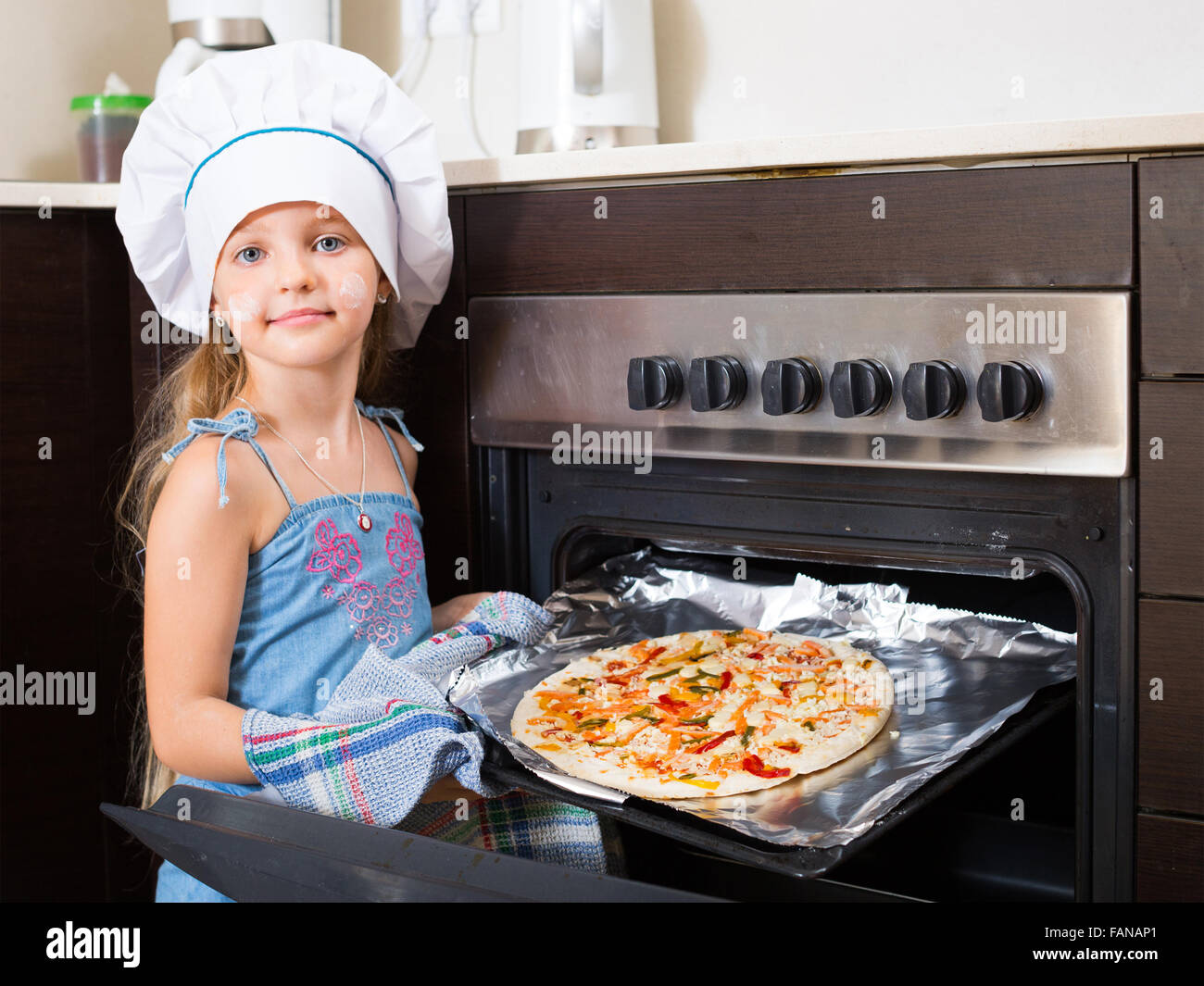 Cheerful kid prepared Italian pizza at home Stock Photo - Alamy