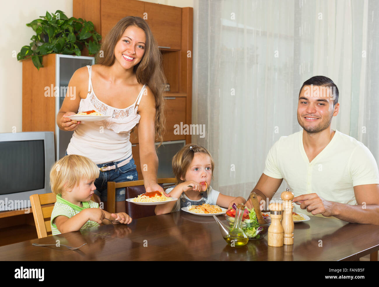 Father daughter eating pasta together hi-res stock photography and ...