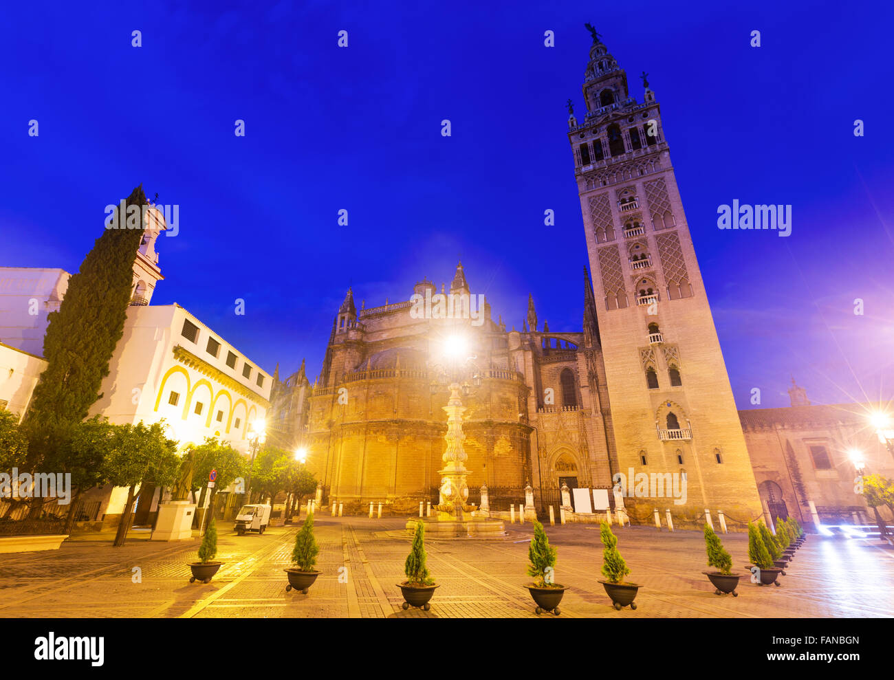 Wide angle shot of Seville Cathedral with Giralda tower in evening ...