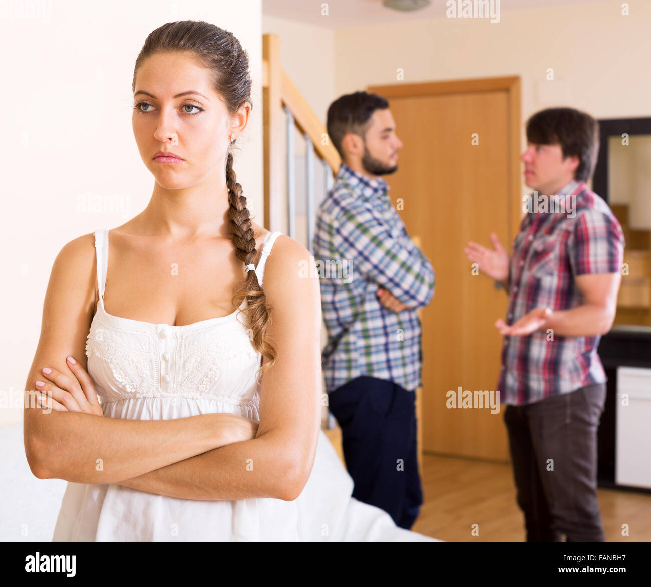 Quarrel in young polygamous family indoors in the living room Stock ...