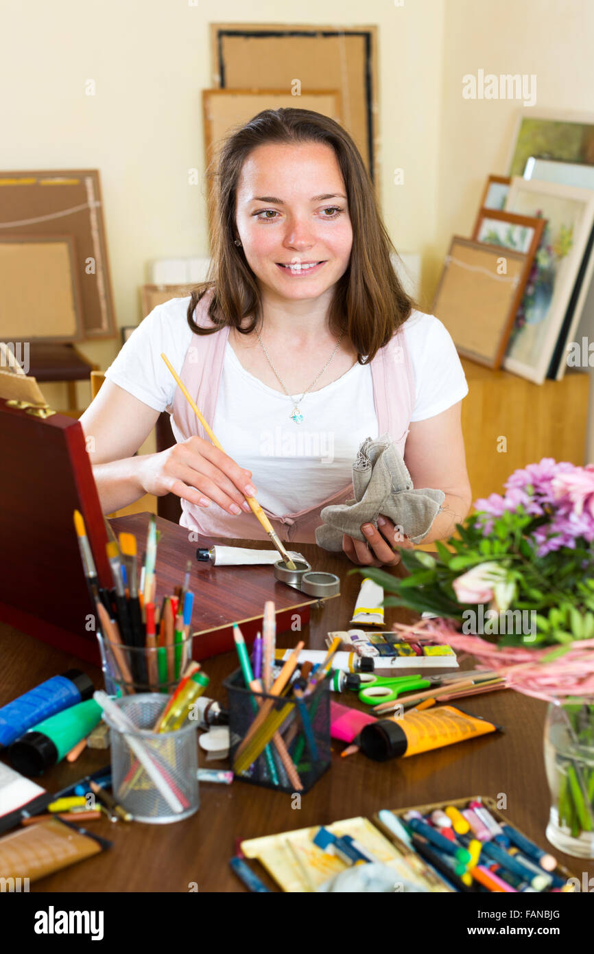 smiling adult artist paints a picture at home Stock Photo - Alamy