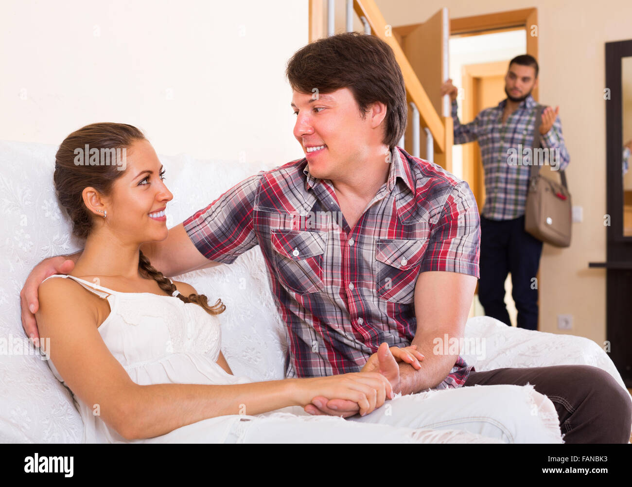 Surprised young spouse coming home hi-res stock photography and images ...