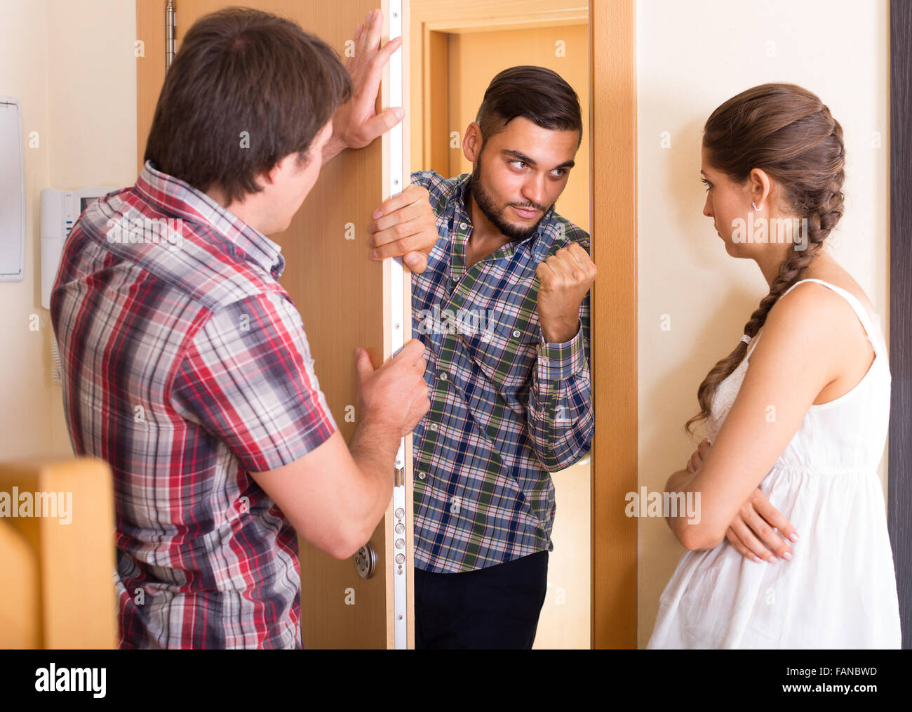 Young family couple having conflict with angry male neighbour at the ...
