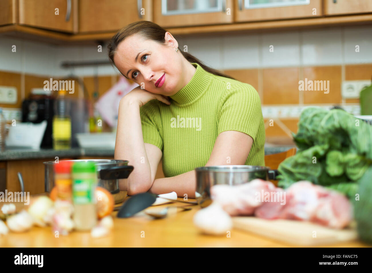 Portrait of sad housewife tired to cook at home Stock Photo - Alamy