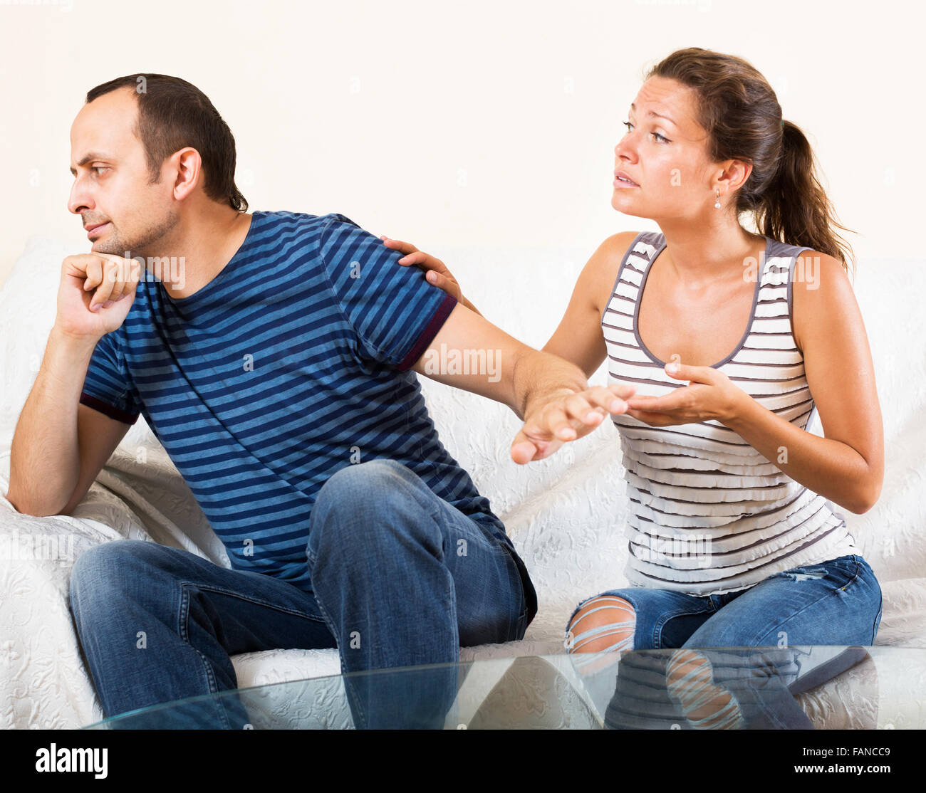 Family couple having a serious conversation at home Stock Photo - Alamy