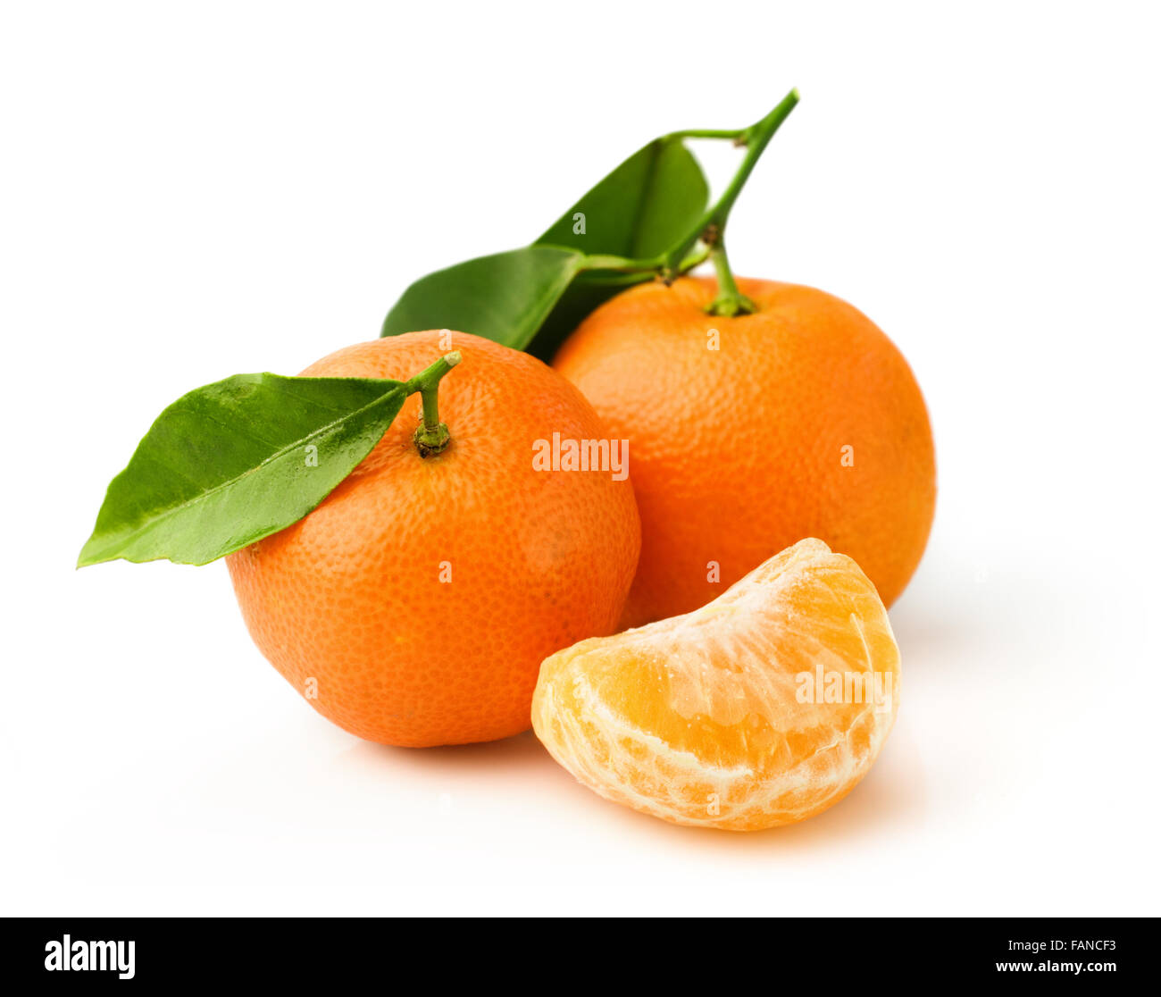 Ripe mandarin with leaves isolated Stock Photo - Alamy