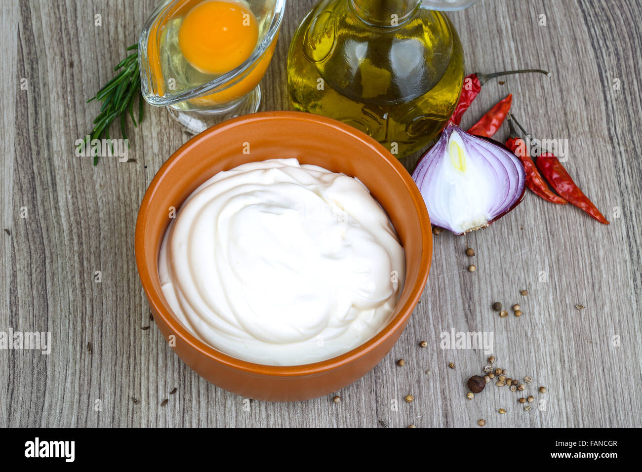 Mayonnaise sauce served raw egg, olive oil and rosemary Stock Photo - Alamy