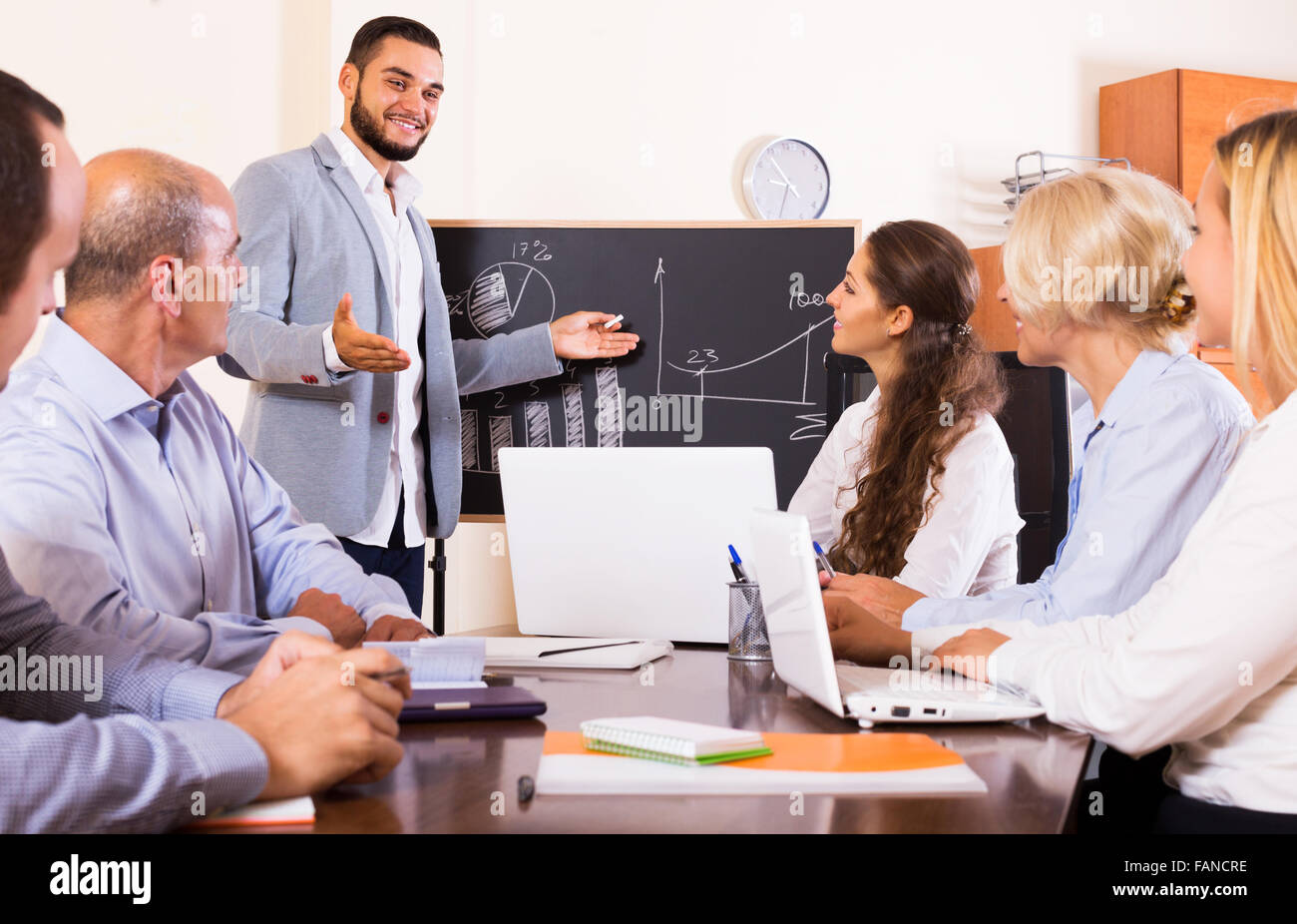 Positive adult business people during conference call indoors Stock ...