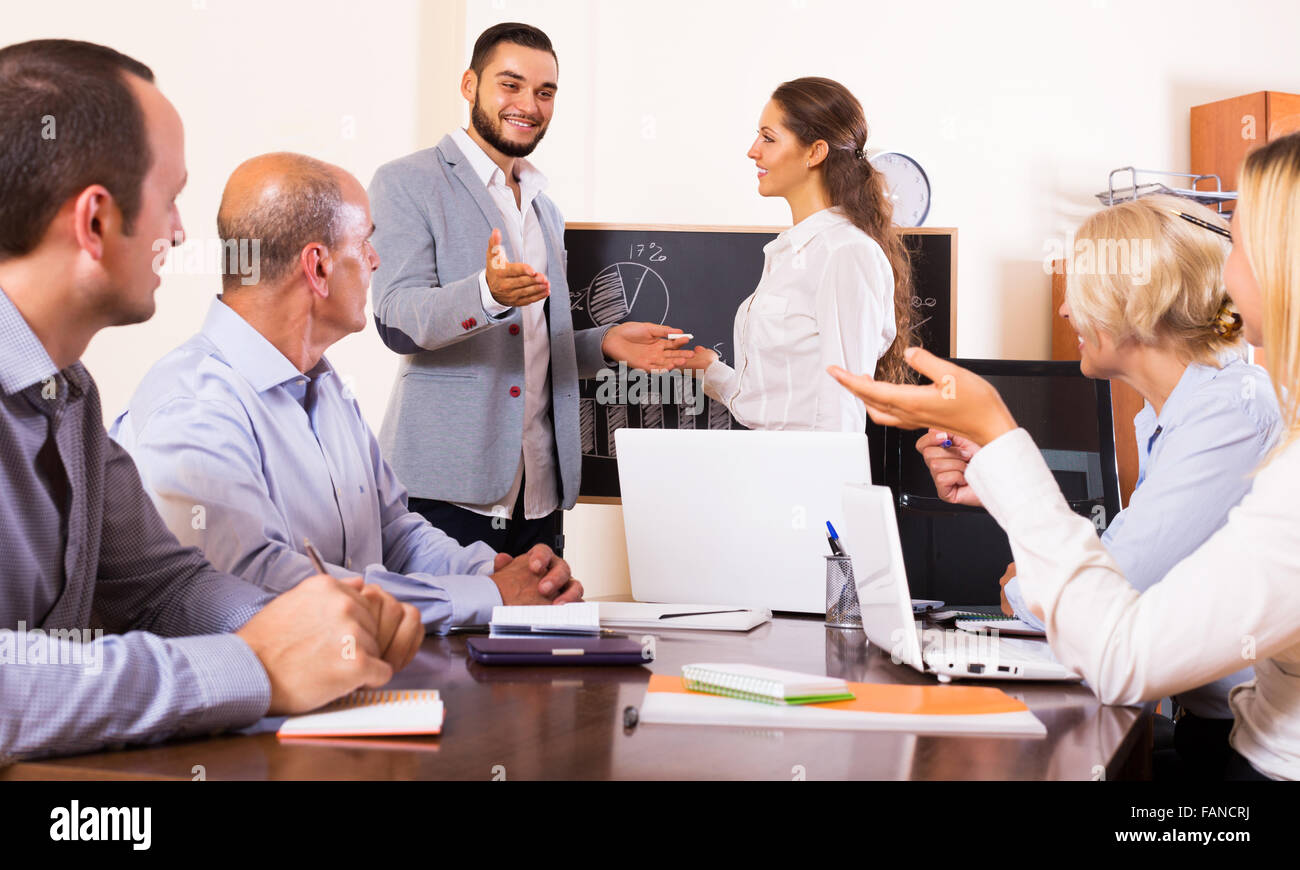 Smiling adult business people during conference call indoors Stock ...