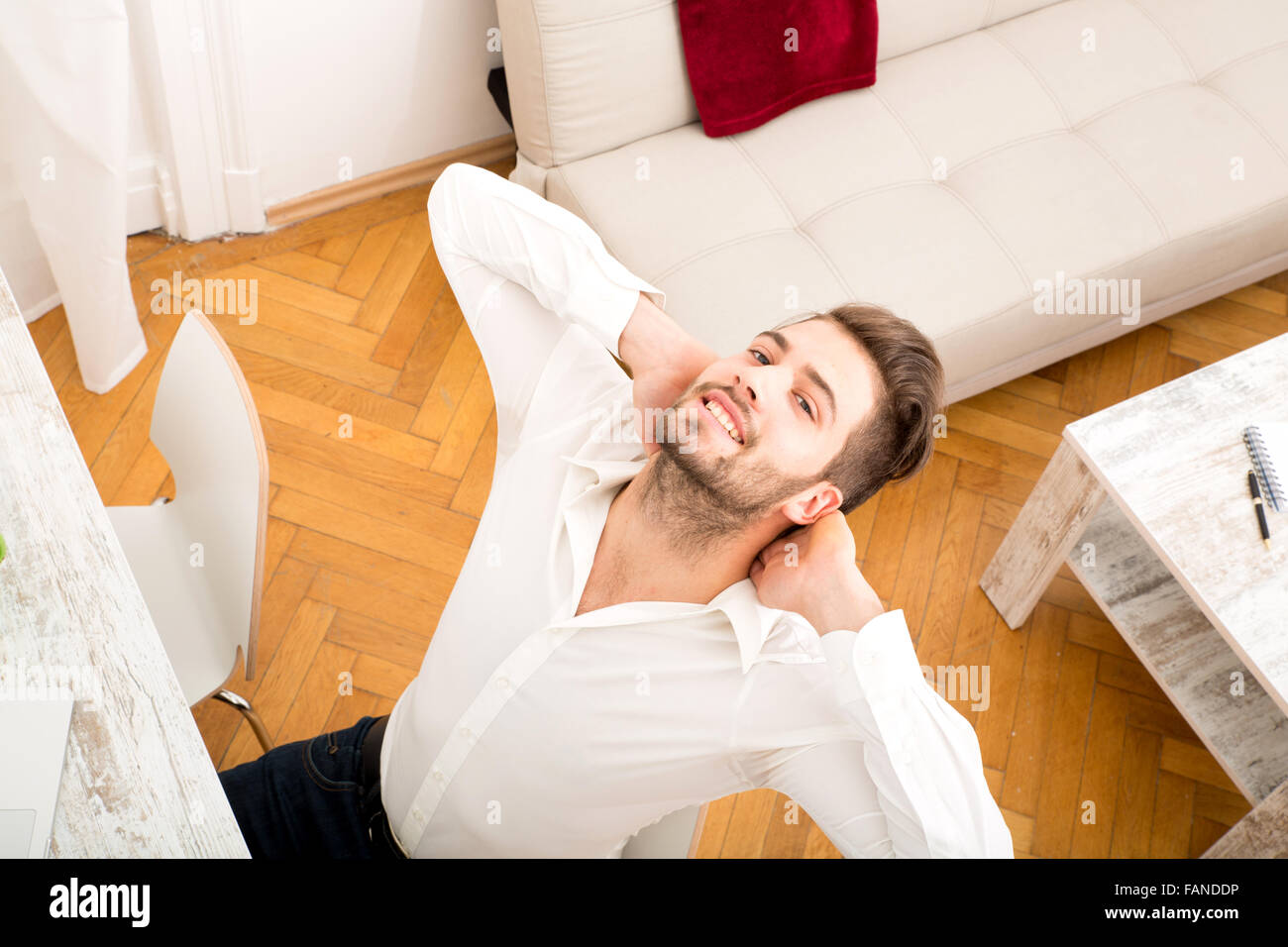 A young adult man relaxing and stretching his back Stock Photo - Alamy