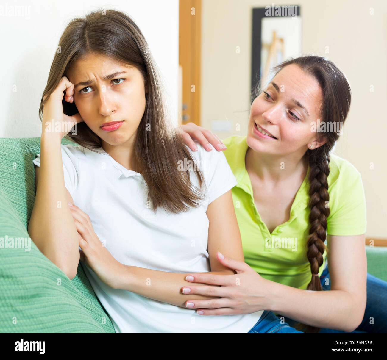 Two women comforting friend emotion hi-res stock photography and images ...