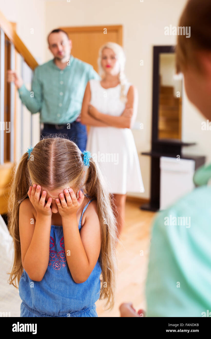 Brother is talking to her sister crying in presence of parents Stock ...