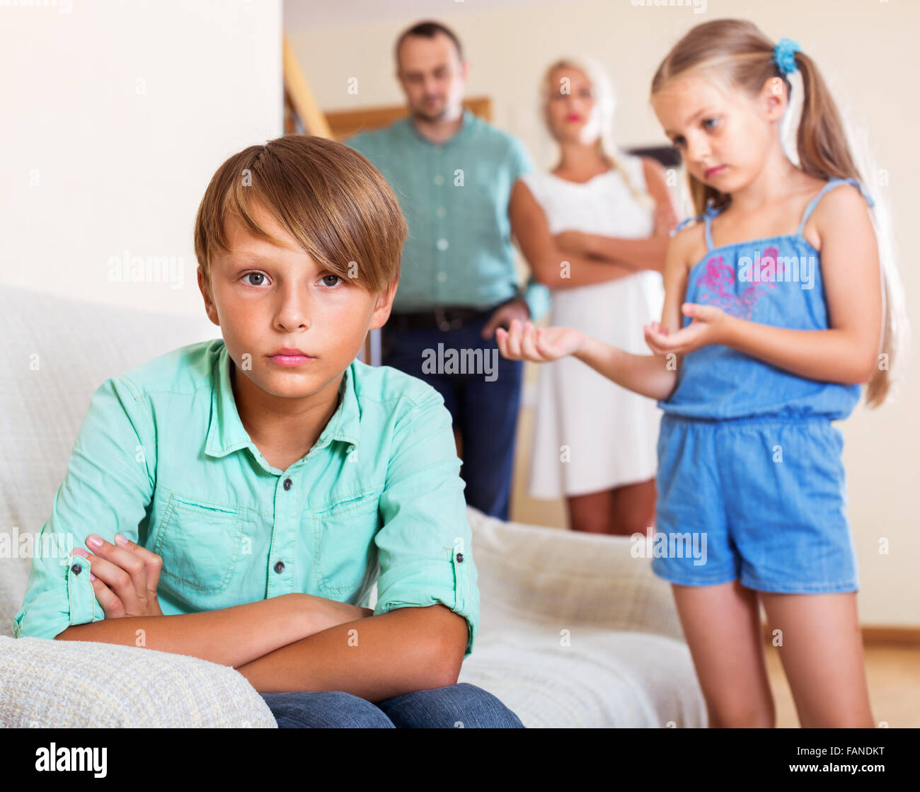 The younger sister is talking with his brother in the presence of ...