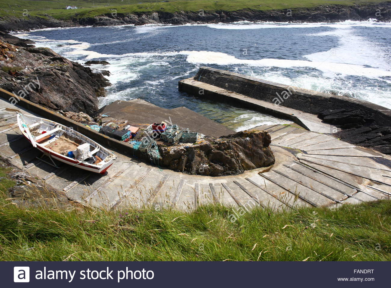 a boat out of the watwer at a cove in Donegal, Ireland Stock Photo - Alamy