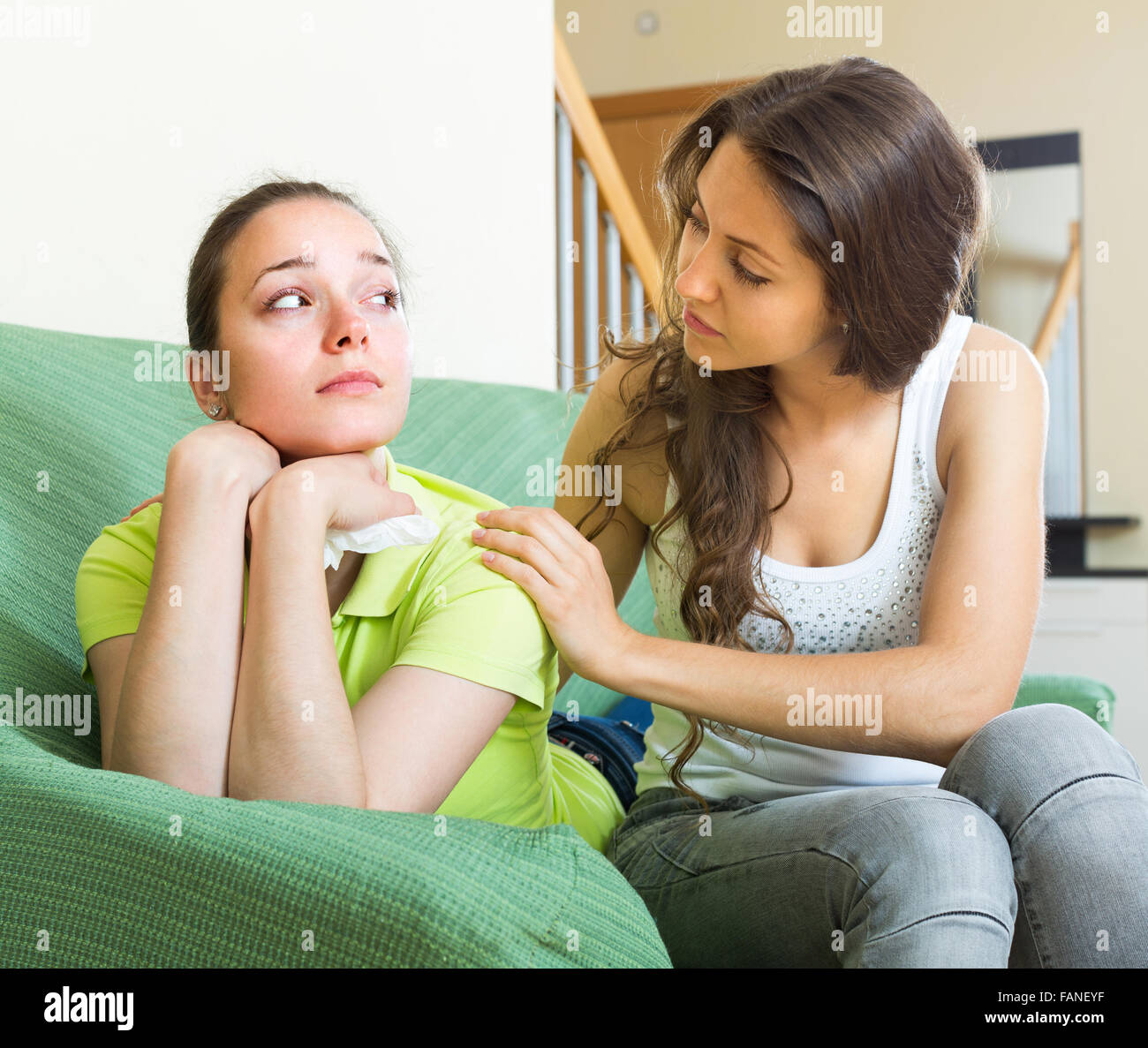 Young longhaired girl calms her upset crying friend Stock Photo - Alamy