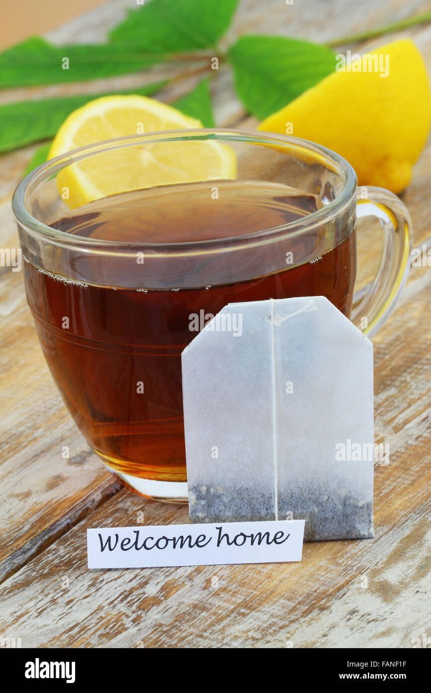 Welcome home card with tea bag leaning against glass of tea, and lemon ...