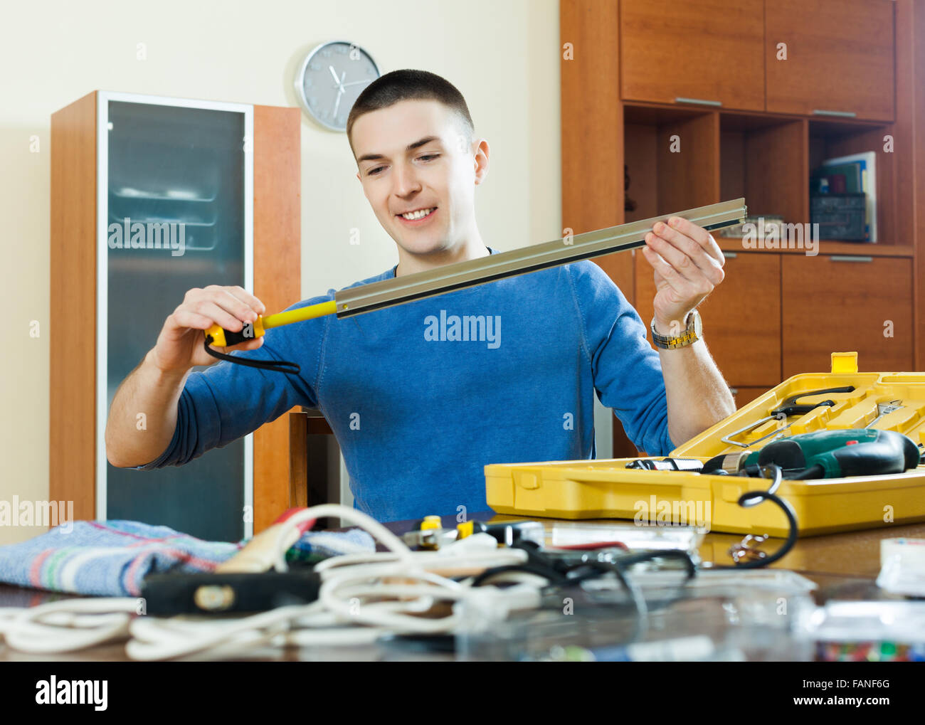 smiling guy with working tools at home Stock Photo - Alamy