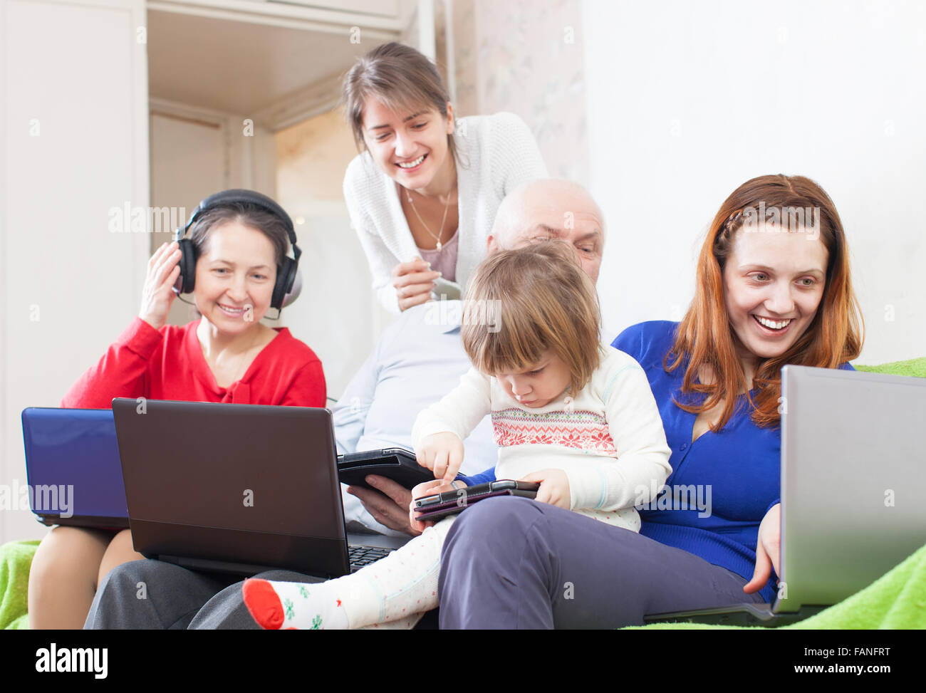 happy people uses few various devices at home Stock Photo - Alamy