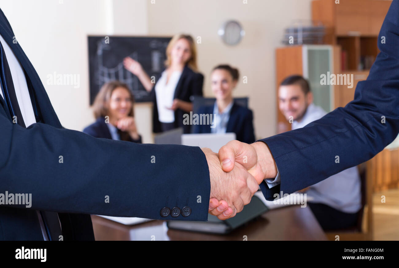 Firm handshake between two creative business partners Stock Photo - Alamy