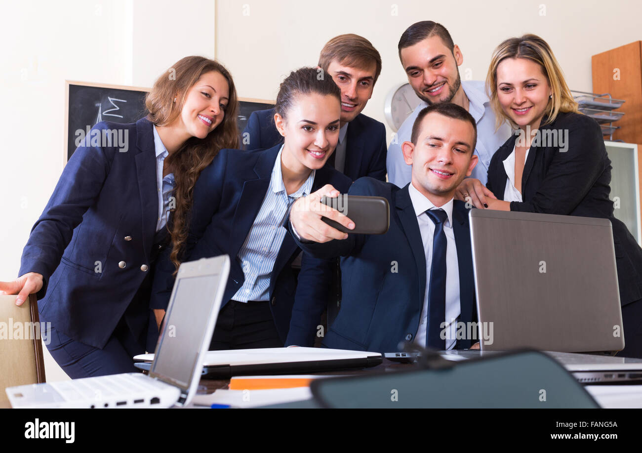 Boss and smiling subordinate officials making selfie in office Stock ...