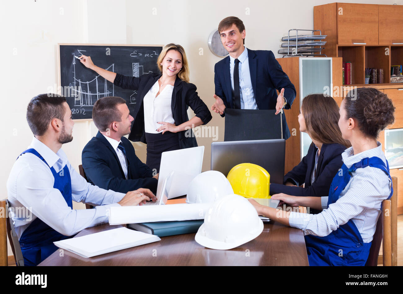 Brainstorming professional engineers smiling hi-res stock photography ...
