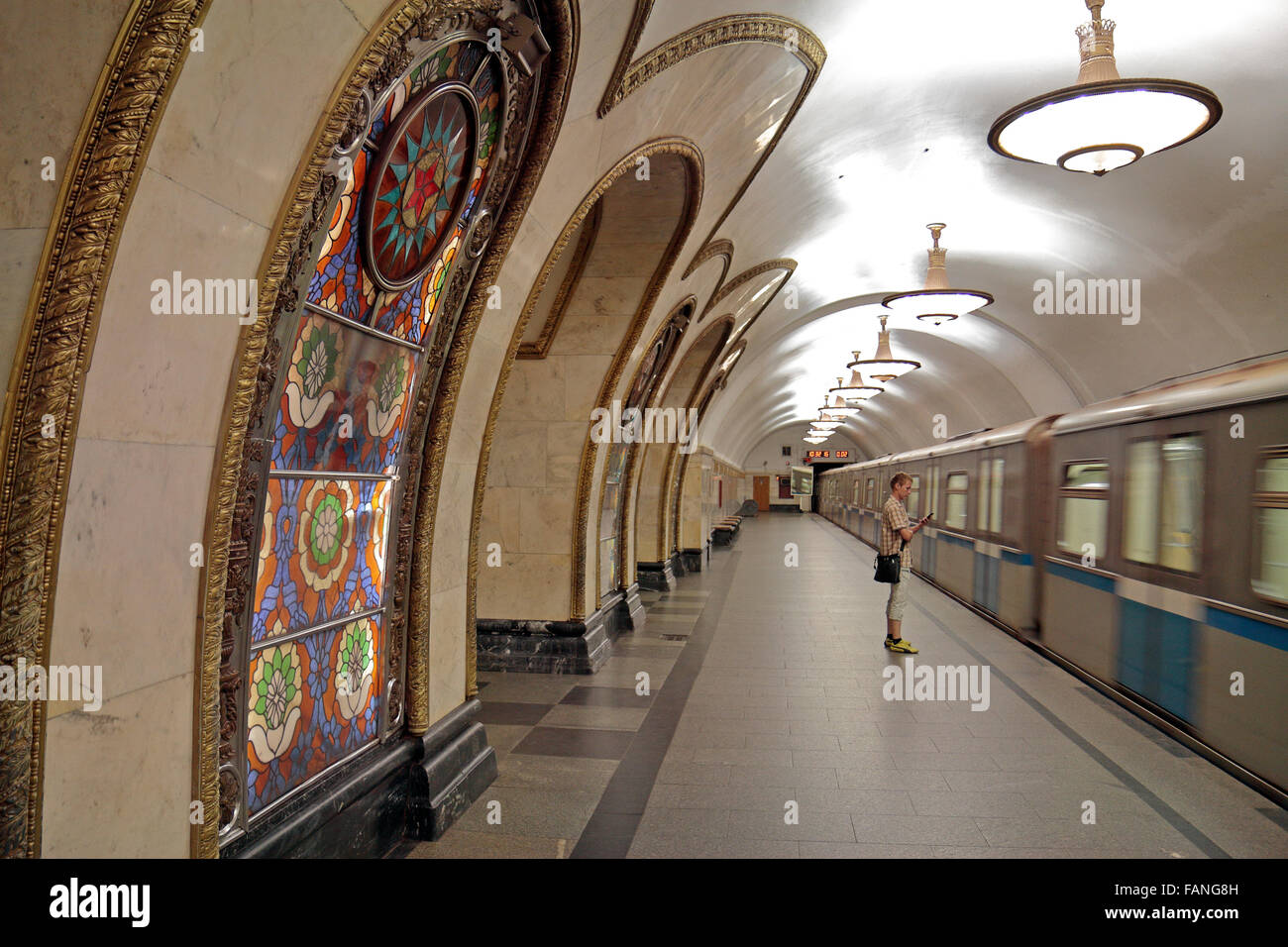 A single passenger waits for a train on the platform in Novoslobodskaya ...
