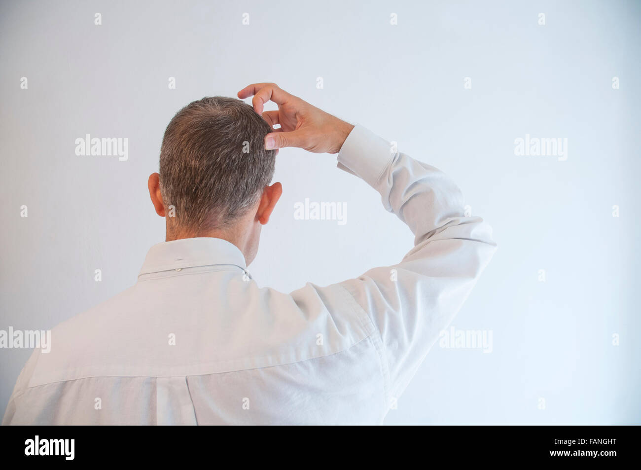 Man scratching his head Stock Photo - Alamy