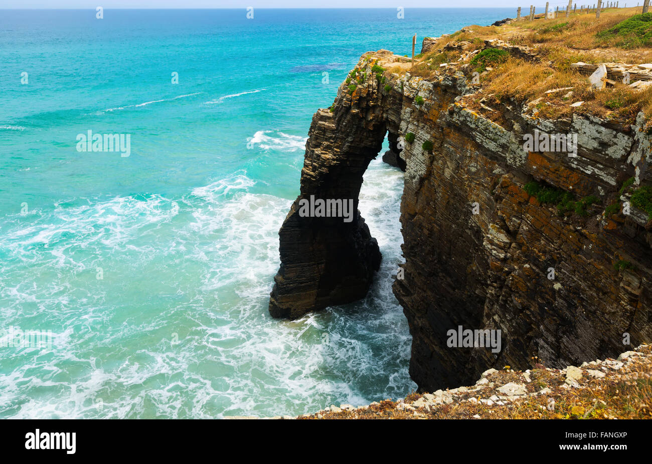 Natural arch at As Catedrais beach in summer day. Atlantic Ocean coast ...
