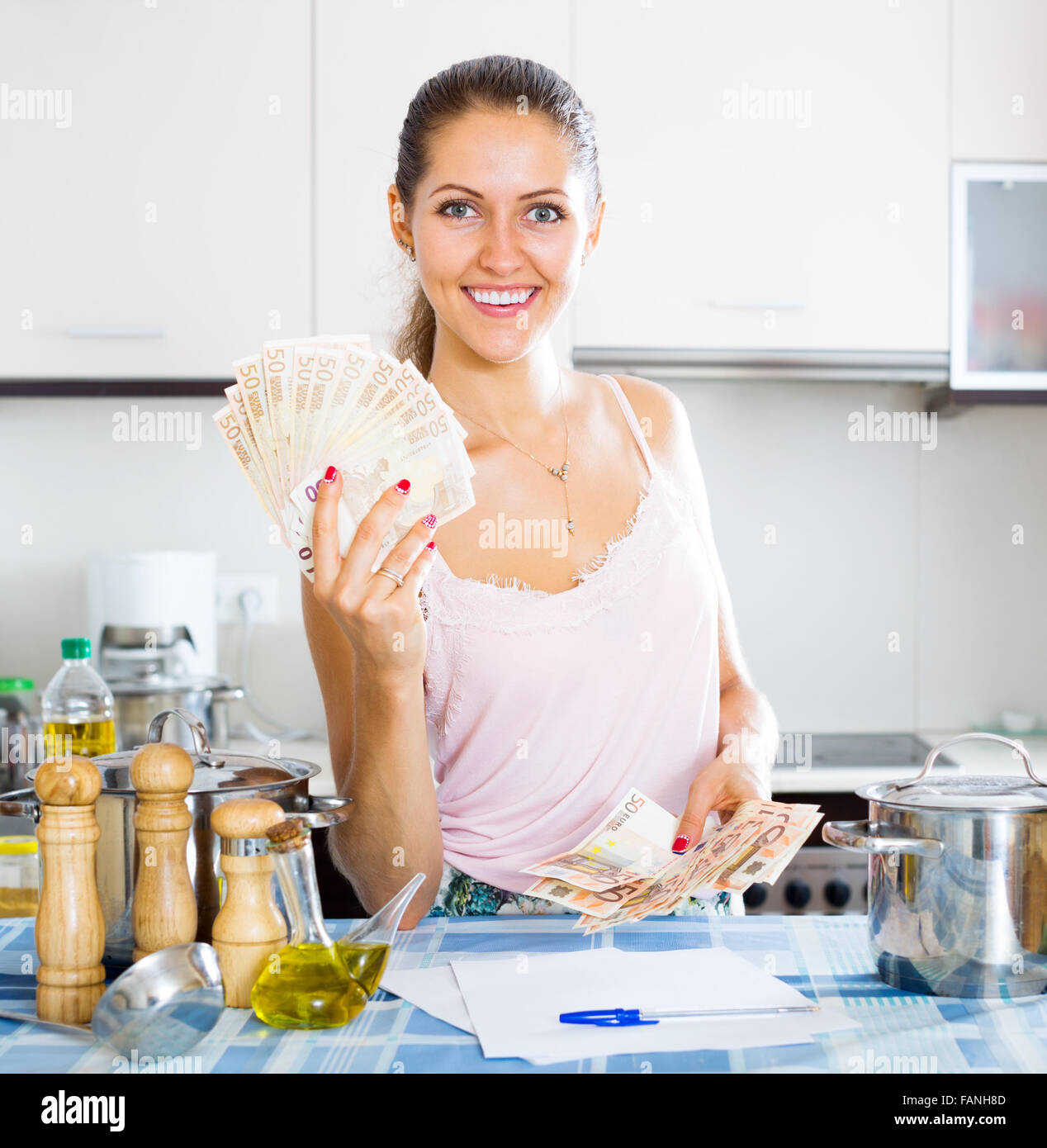 Positive young woman received interest on deposits Stock Photo - Alamy
